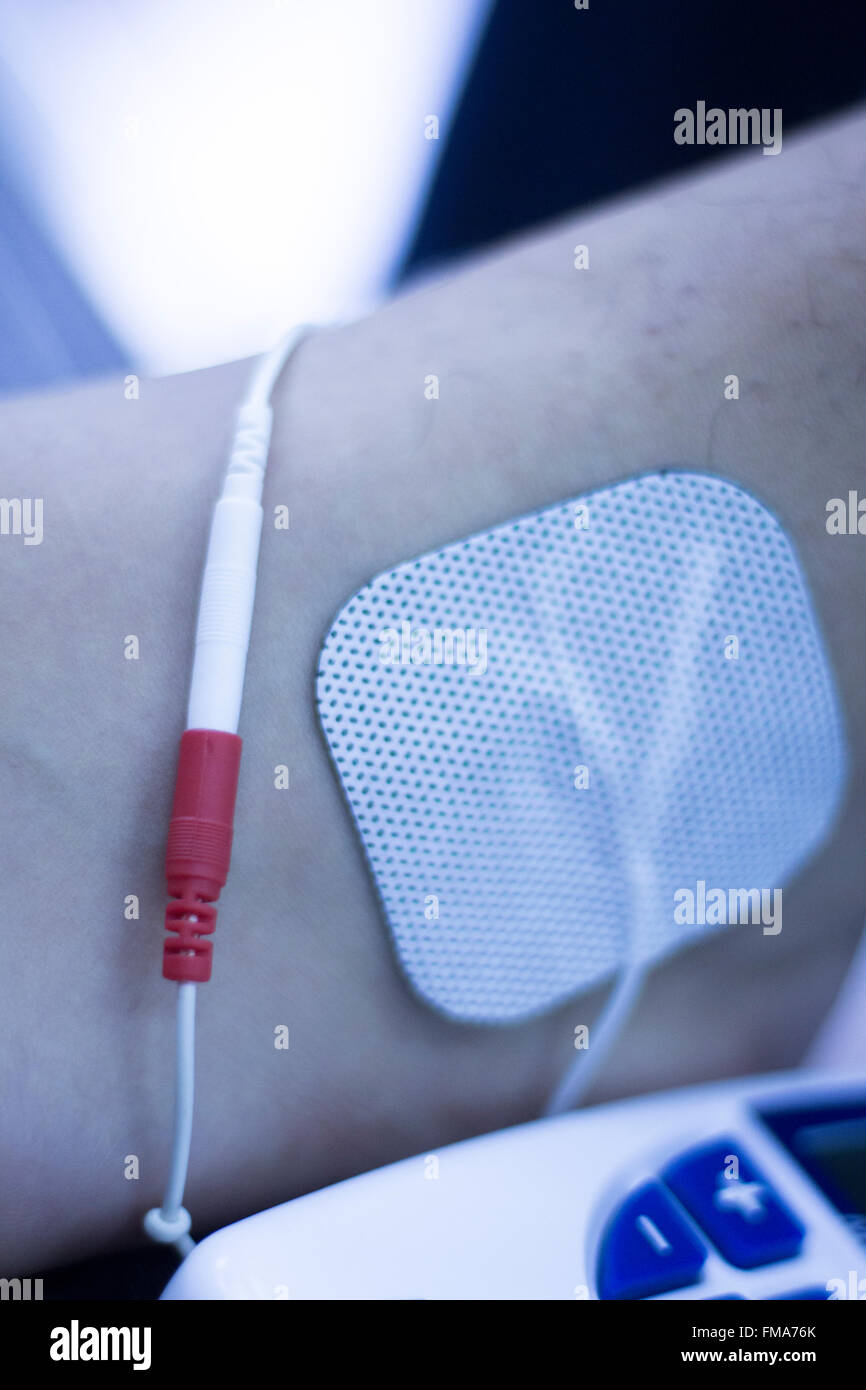 Physical therapy clinic of hospital. Patient having electrical impulse ...
