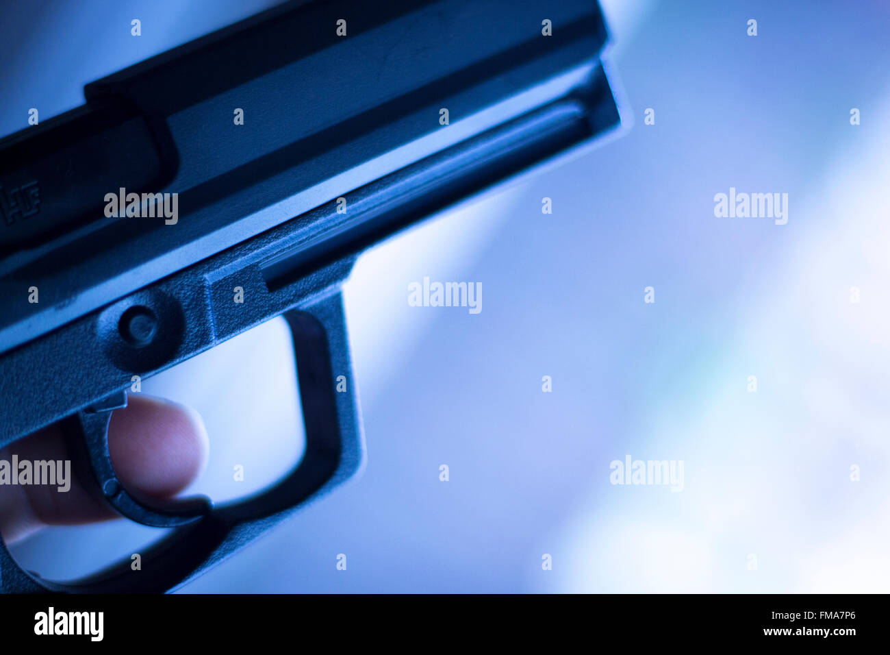 Automatic 9mm pistol handgun weapon in blue photo Stock Photo - Alamy