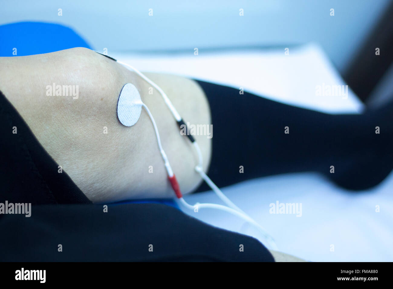 Physical therapy clinic of hospital. Patient having electrical impulse ...