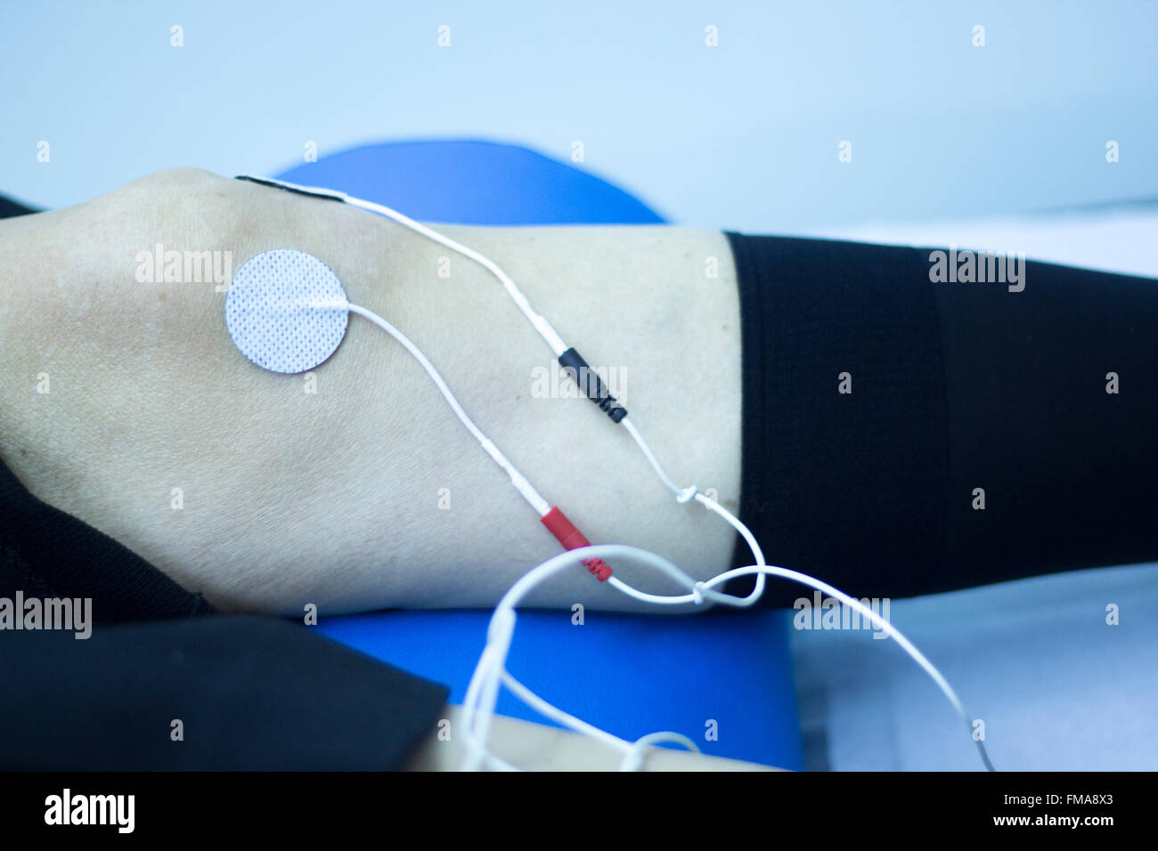 Physical therapy clinic of hospital. Patient having electrical impulse ...