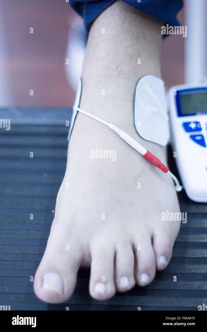 Physical therapy clinic of hospital. Patient having electrical impulse ...