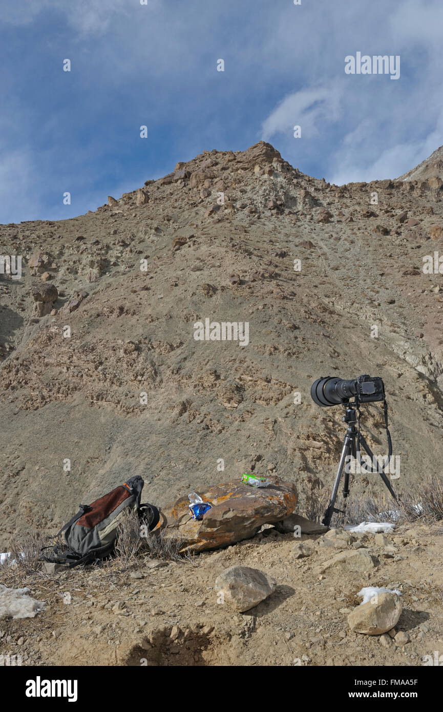 Nature photographers on the barren snow covered mountain slopes in the ...