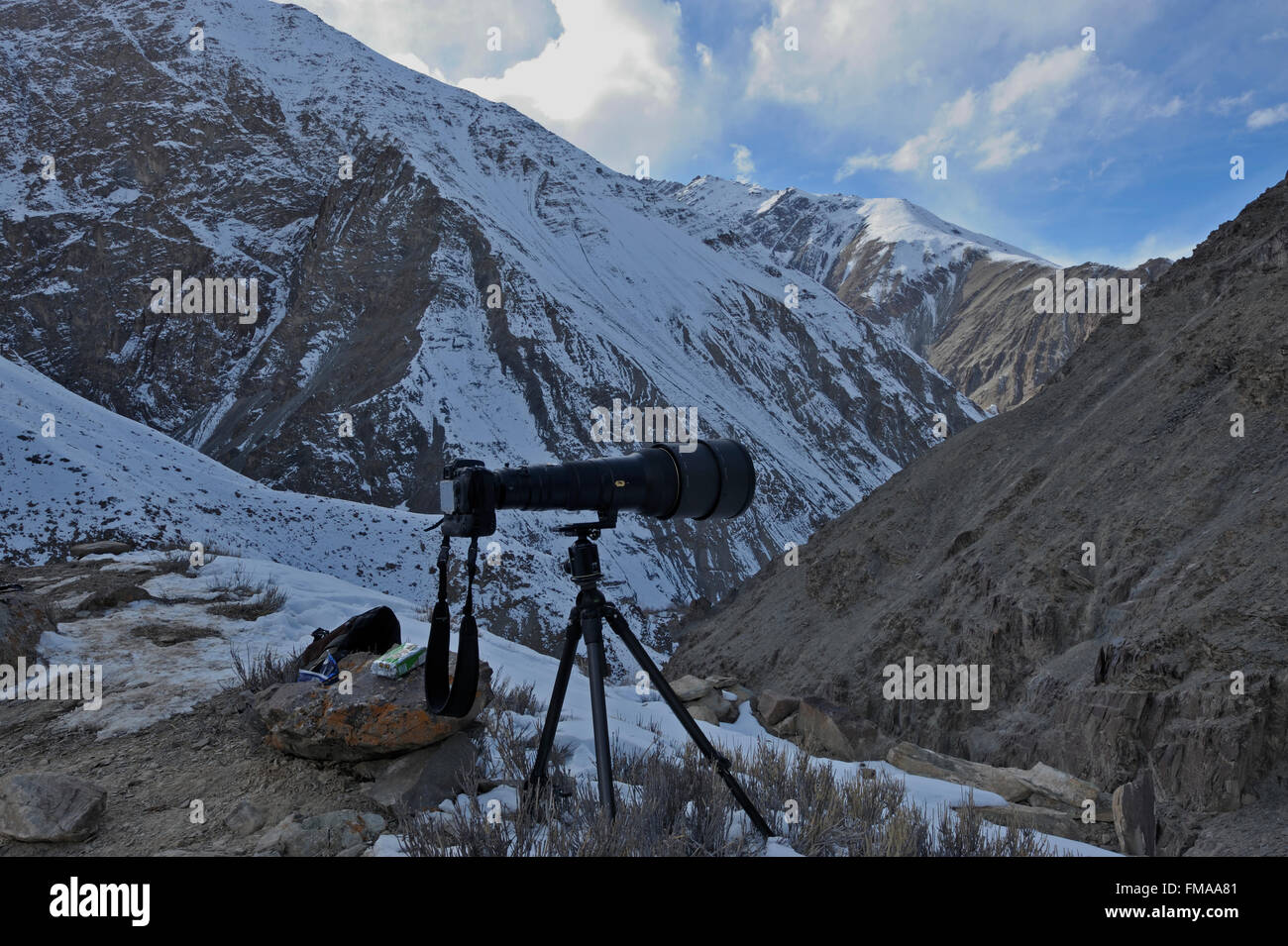 Nature photographers on the barren snow covered mountain slopes in the ...