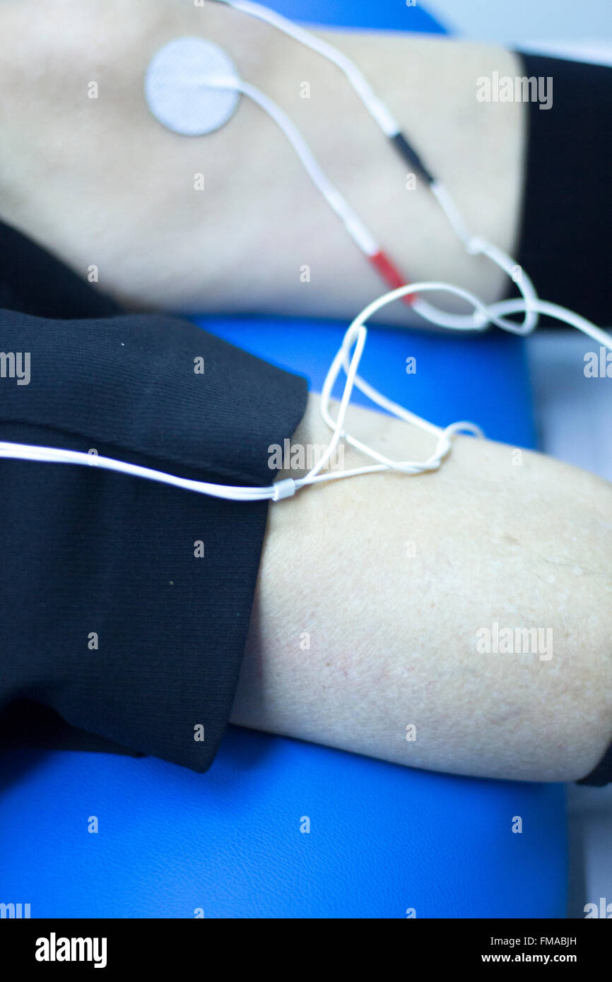 Physical therapy clinic of hospital. Patient having electrical impulse ...