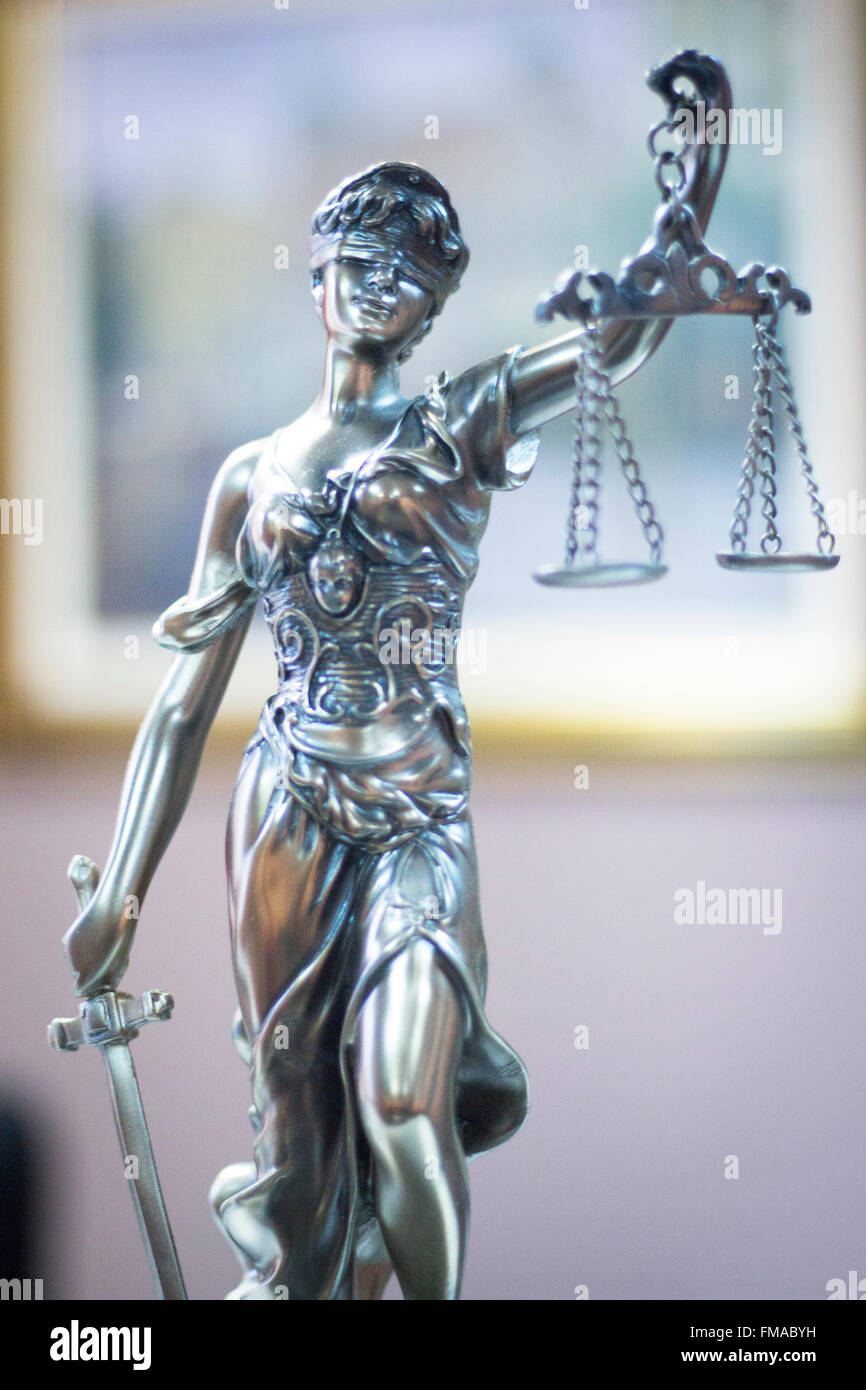 Legal blind justice metal statue with scales in chain in law firm ...