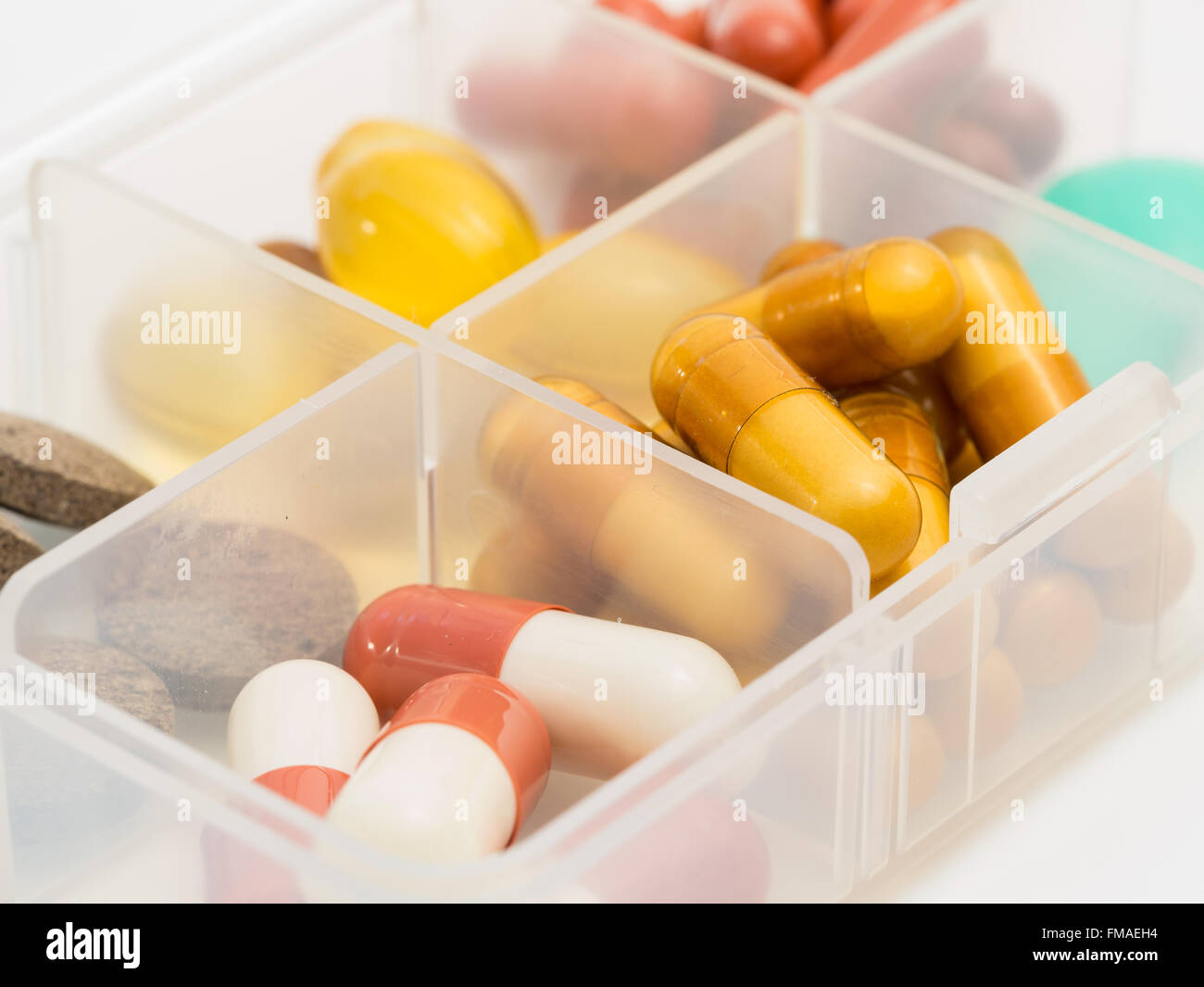 A container for pills with different medicines Stock Photo - Alamy