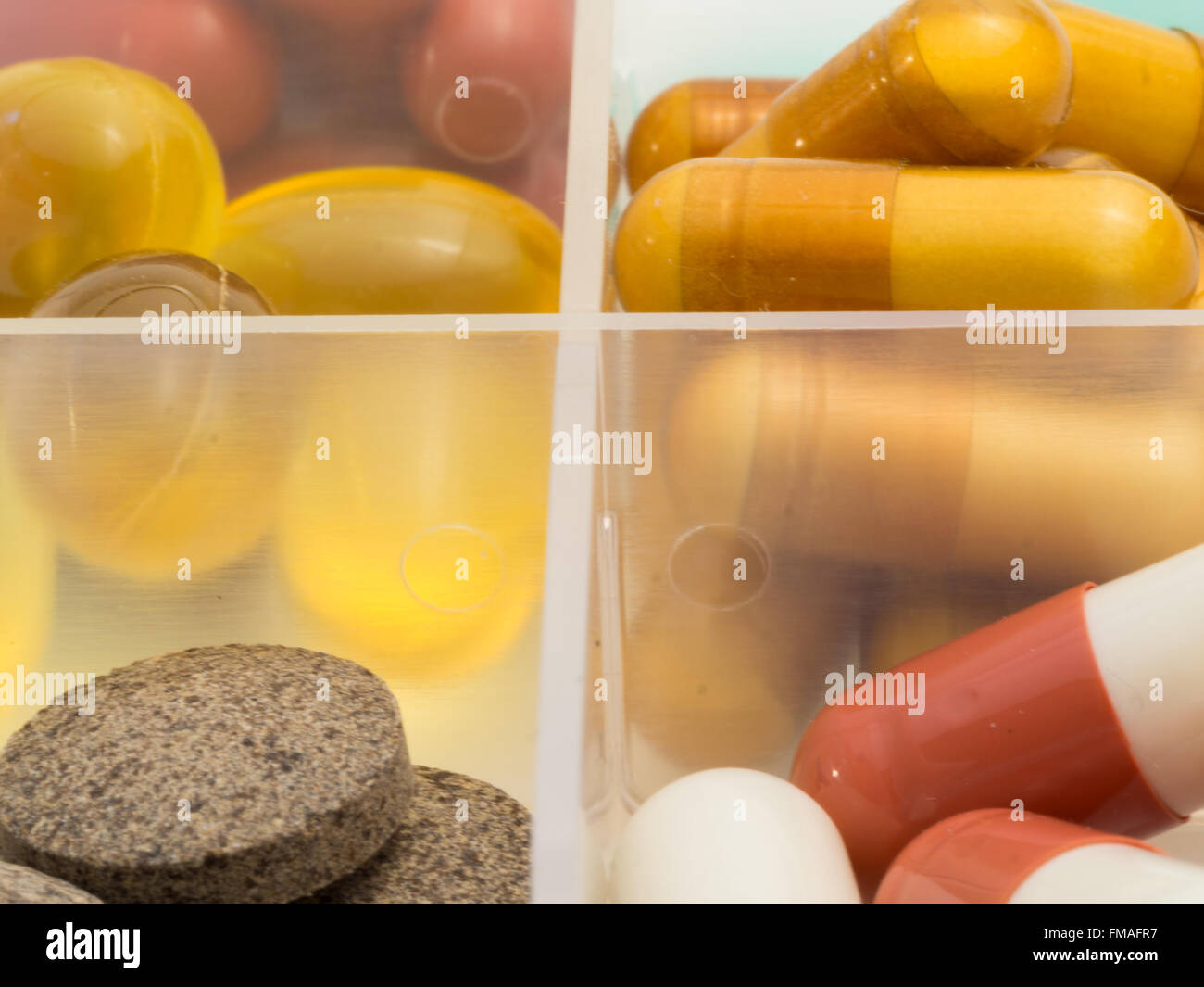 A container for pills with different medicines Stock Photo - Alamy
