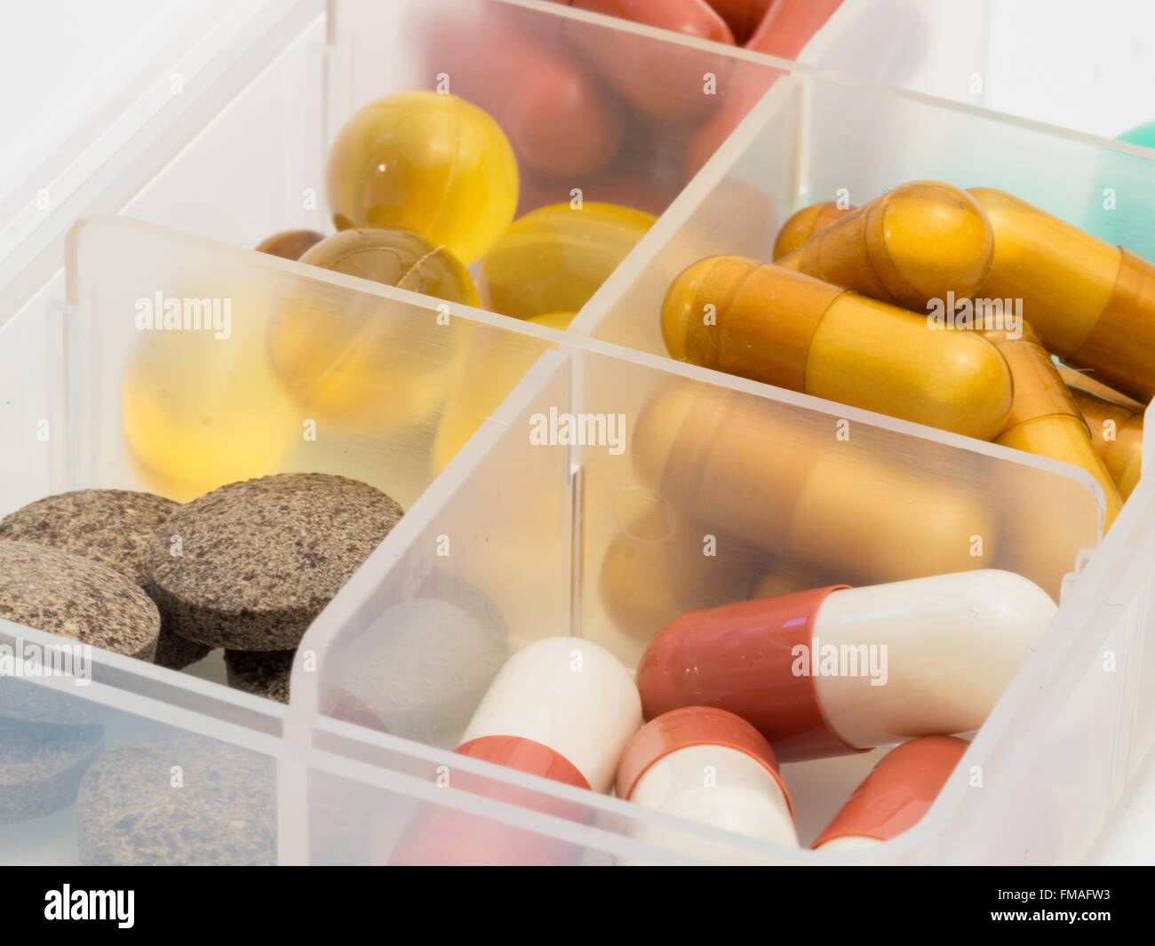 A container for pills with different medicines Stock Photo - Alamy