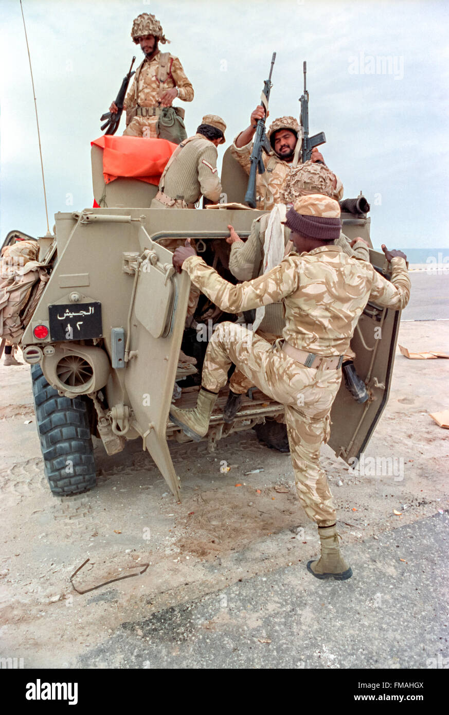 Saudi Arabian soldiers load into an armored personnel carrier during ...