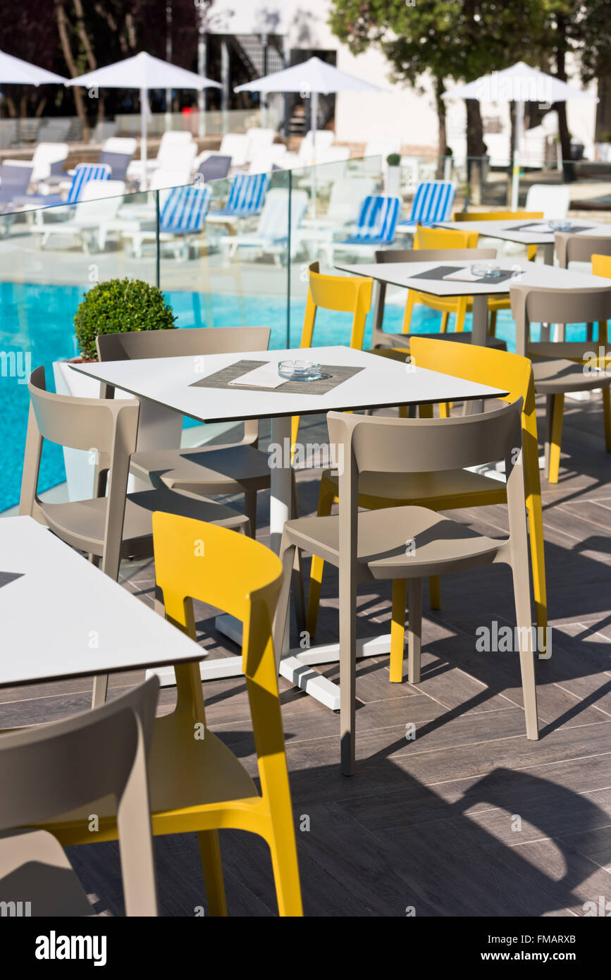 Summer cafe with plastic furniture near swimming pool Stock Photo - Alamy