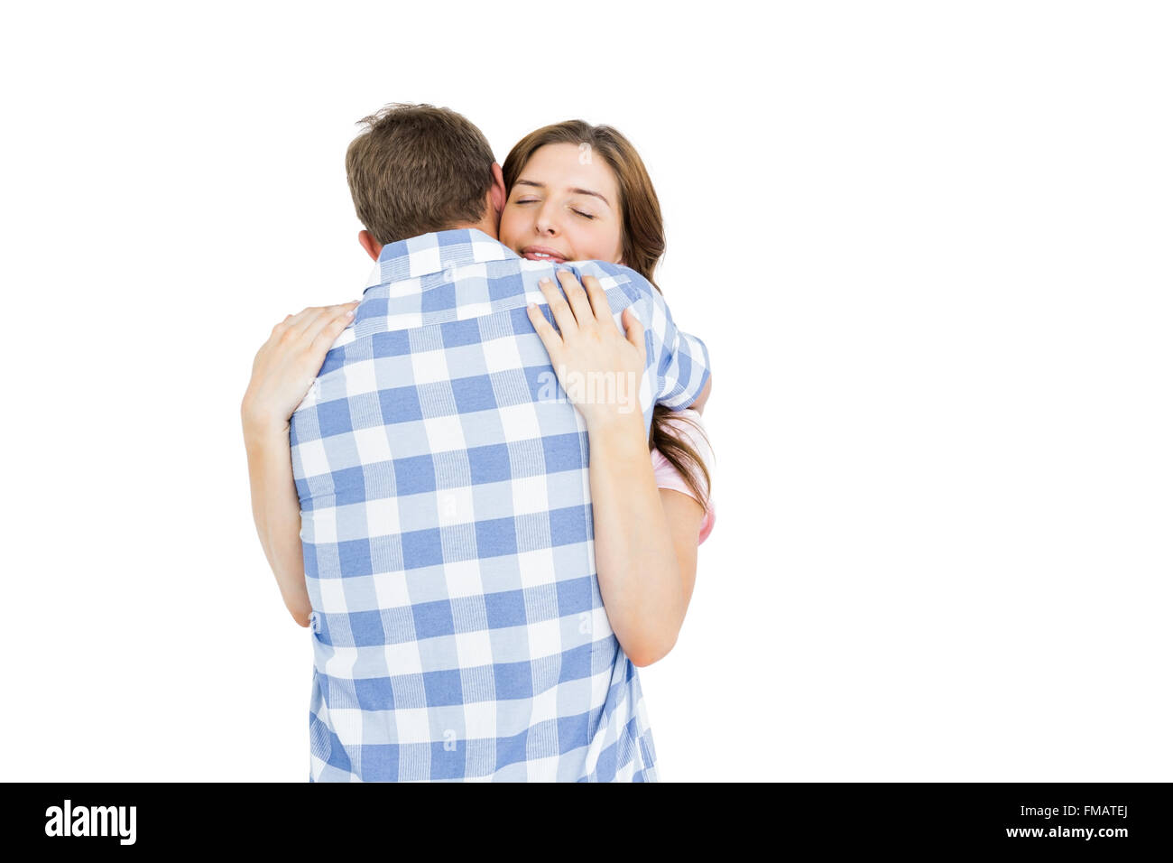Happy young couple cuddling each other Stock Photo - Alamy