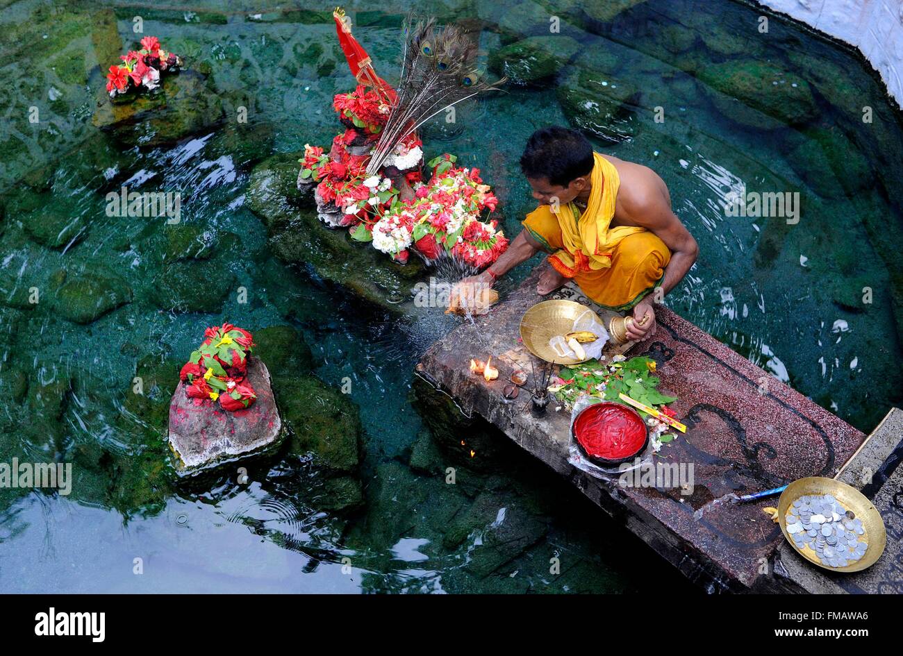 India, Odisha, Taptapani, puja, offering in the sacred warm springs ...