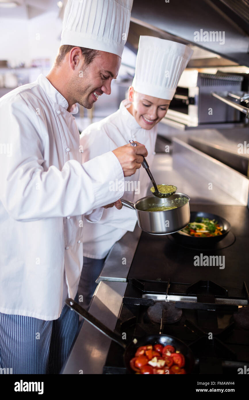 Chef preparing food in the kitchen Stock Photo - Alamy