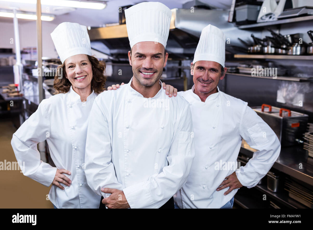 Group of happy chefs smiling at the camera Stock Photo - Alamy