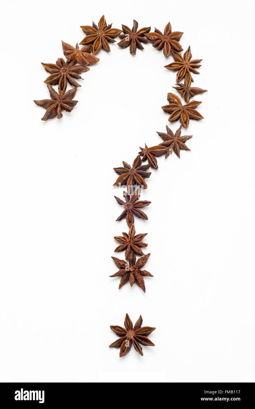Question mark made of star anise Stock Photo - Alamy