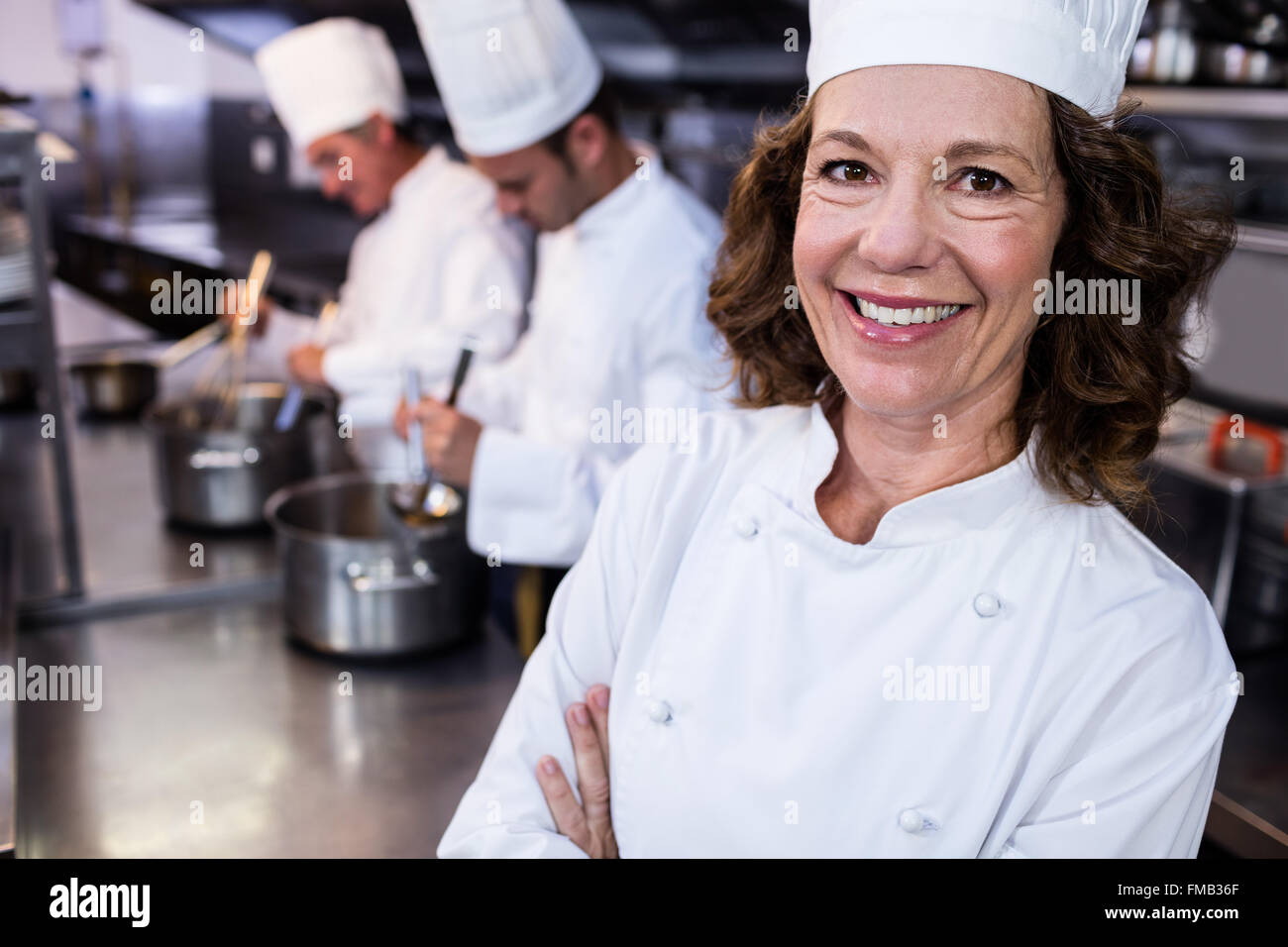 Portrait of smiling chef in commercial kitchen Stock Photo - Alamy