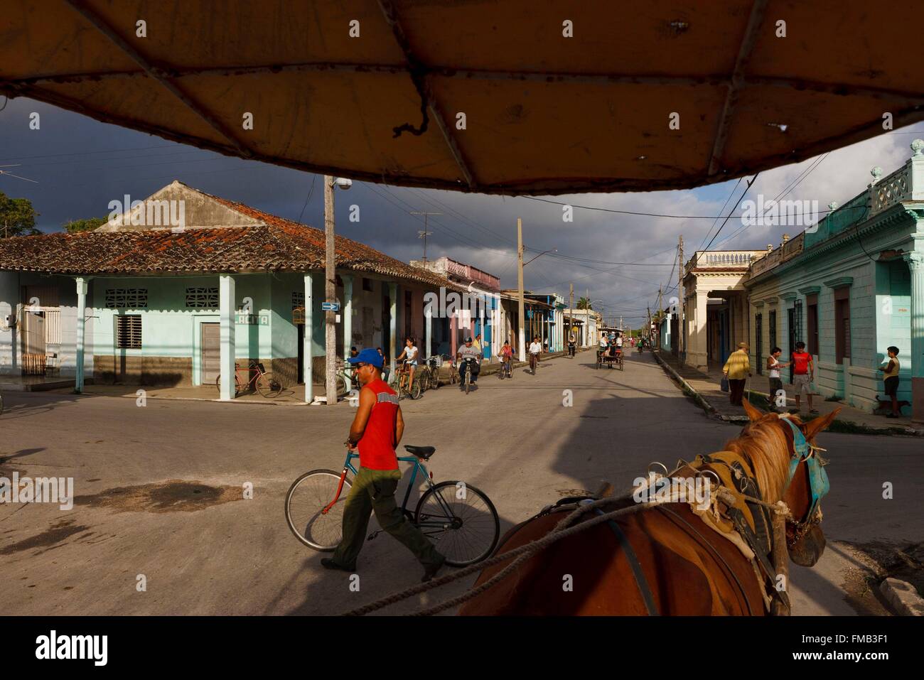 Cuba, Villa Clara, Caibarien, Cuban street view from inside a cart ...