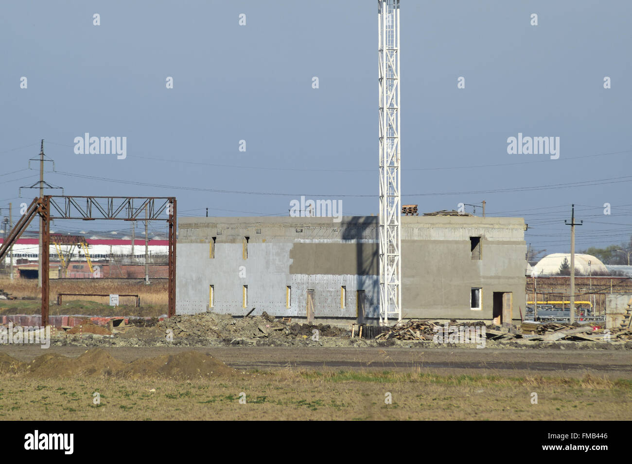 Building under construction. The construction of auxiliary buildings at ...