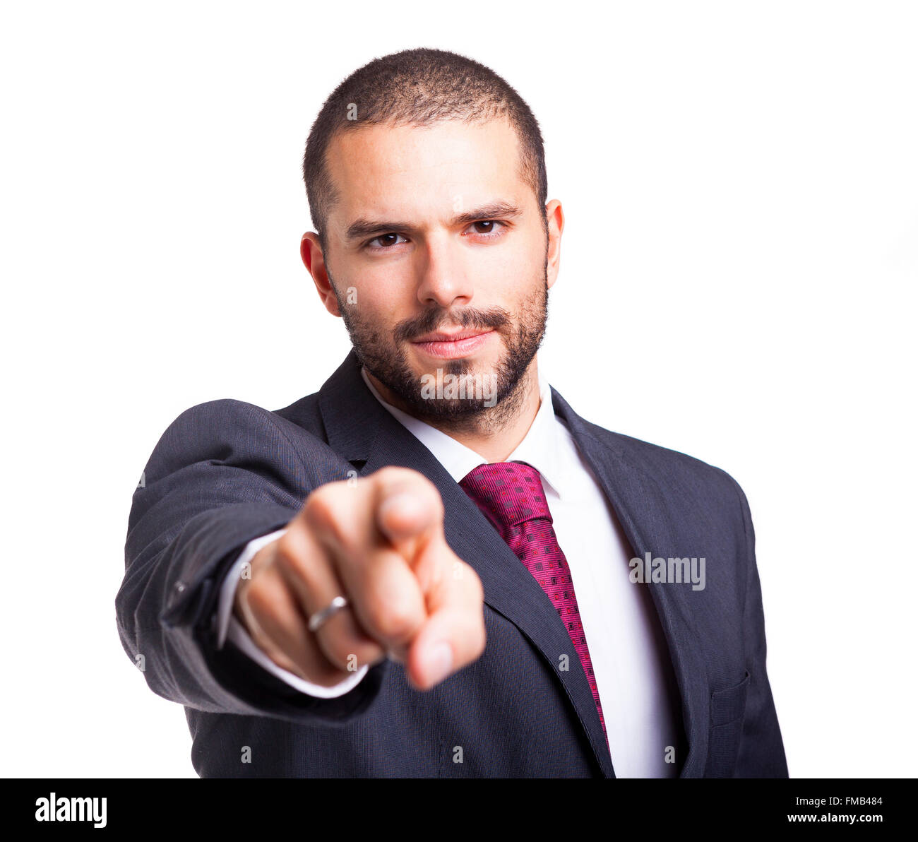 Executive man pointing the finger at you, isolated on white background ...