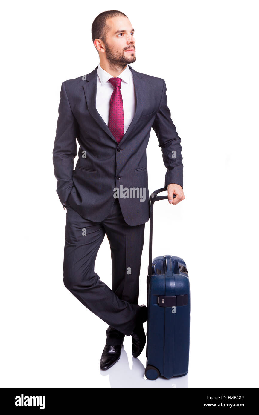 Business man standing with suitcase on white background Stock Photo - Alamy