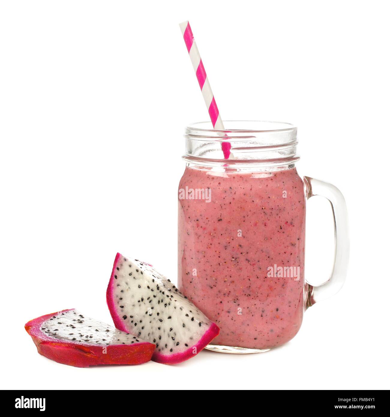 Pink raspberry, dragon fruit smoothie in jar glass with fruit slices ...