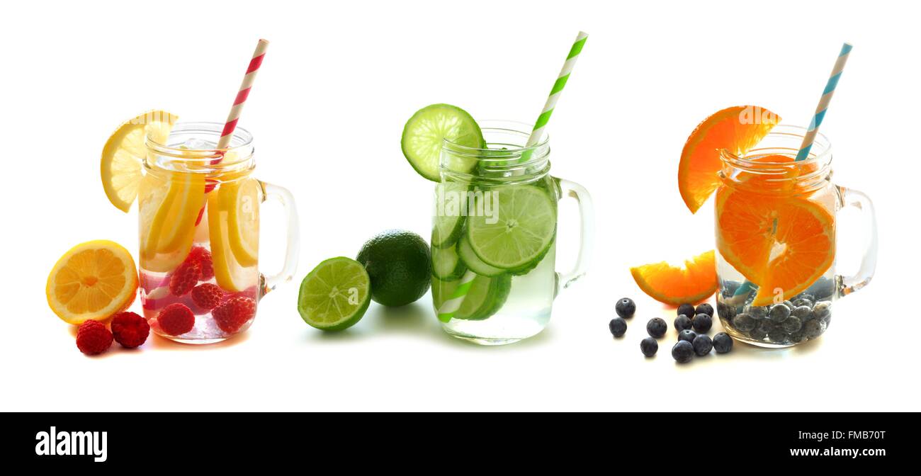 Three types of healthy detox water with fruit in mason jars isolated on ...