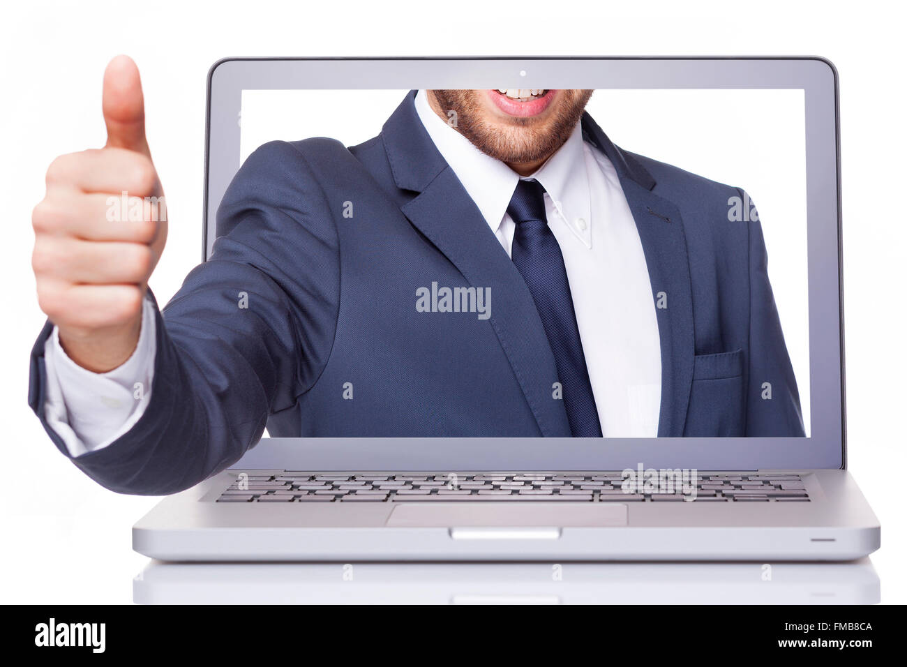 Business man thumbs up through a laptop, isolated on white background ...