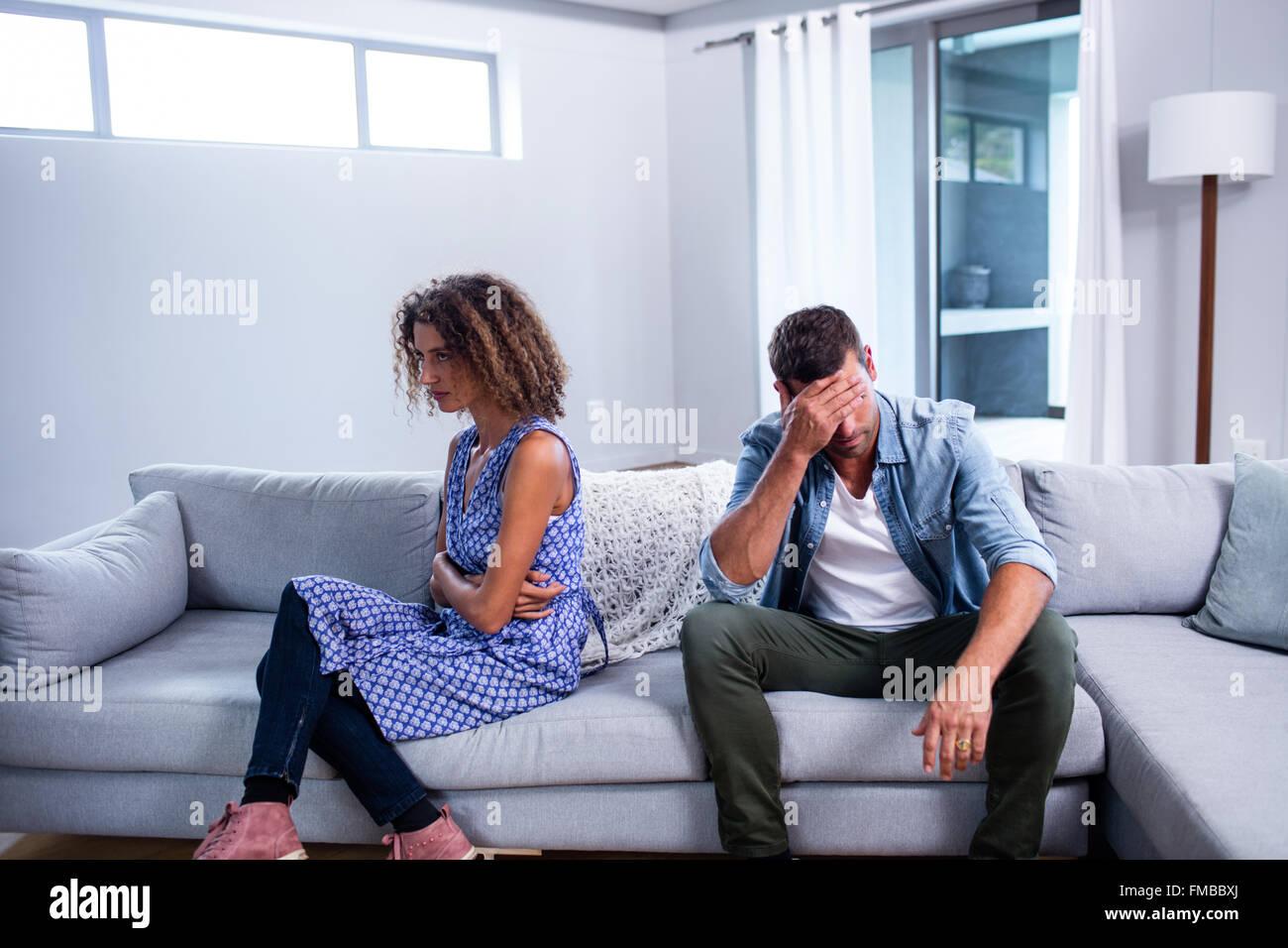 Upset young couple ignoring each other Stock Photo - Alamy
