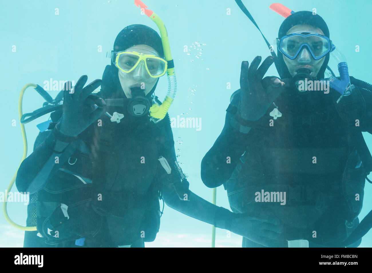 Couple practicing scuba diving together Stock Photo - Alamy