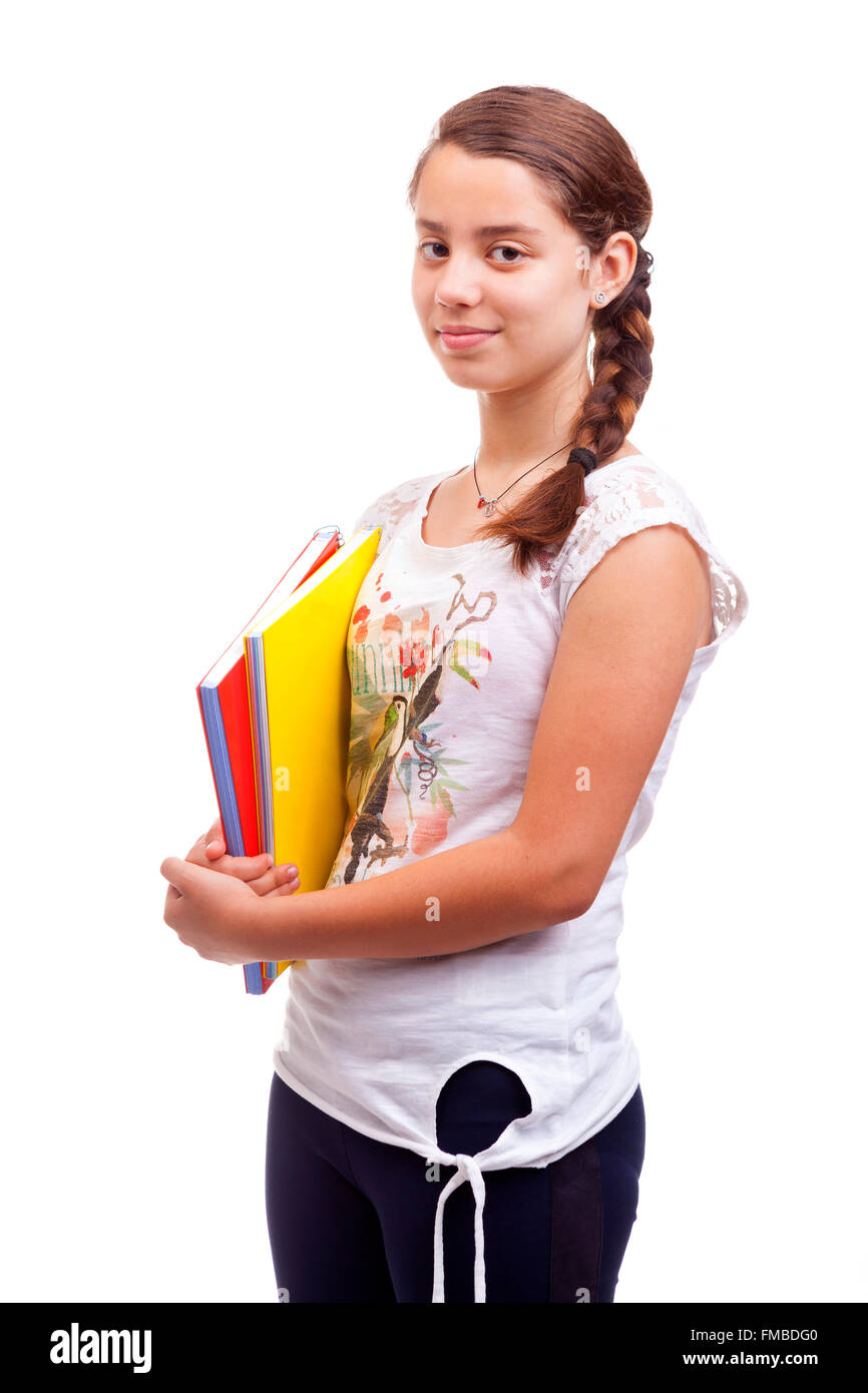 Cute teen girl holding notebooks on white background Stock Photo - Alamy