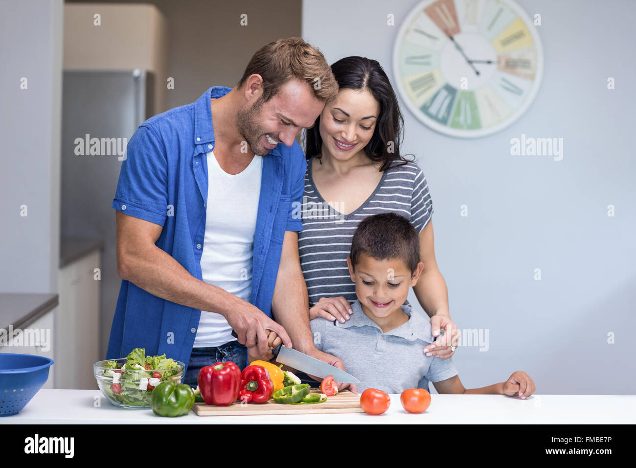 Happy family in the kitchen Stock Photo - Alamy
