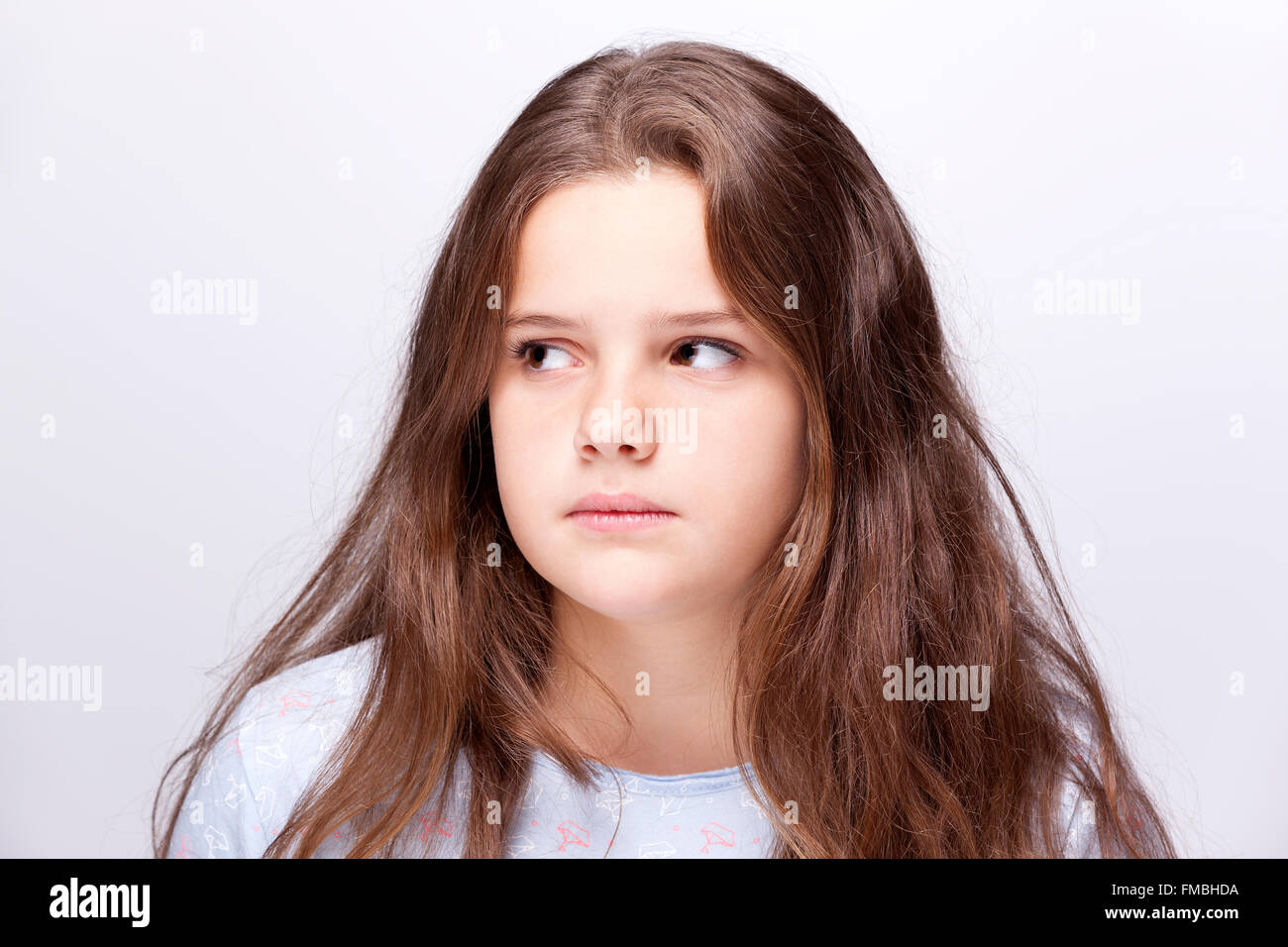 Sad girl on grey background Stock Photo - Alamy
