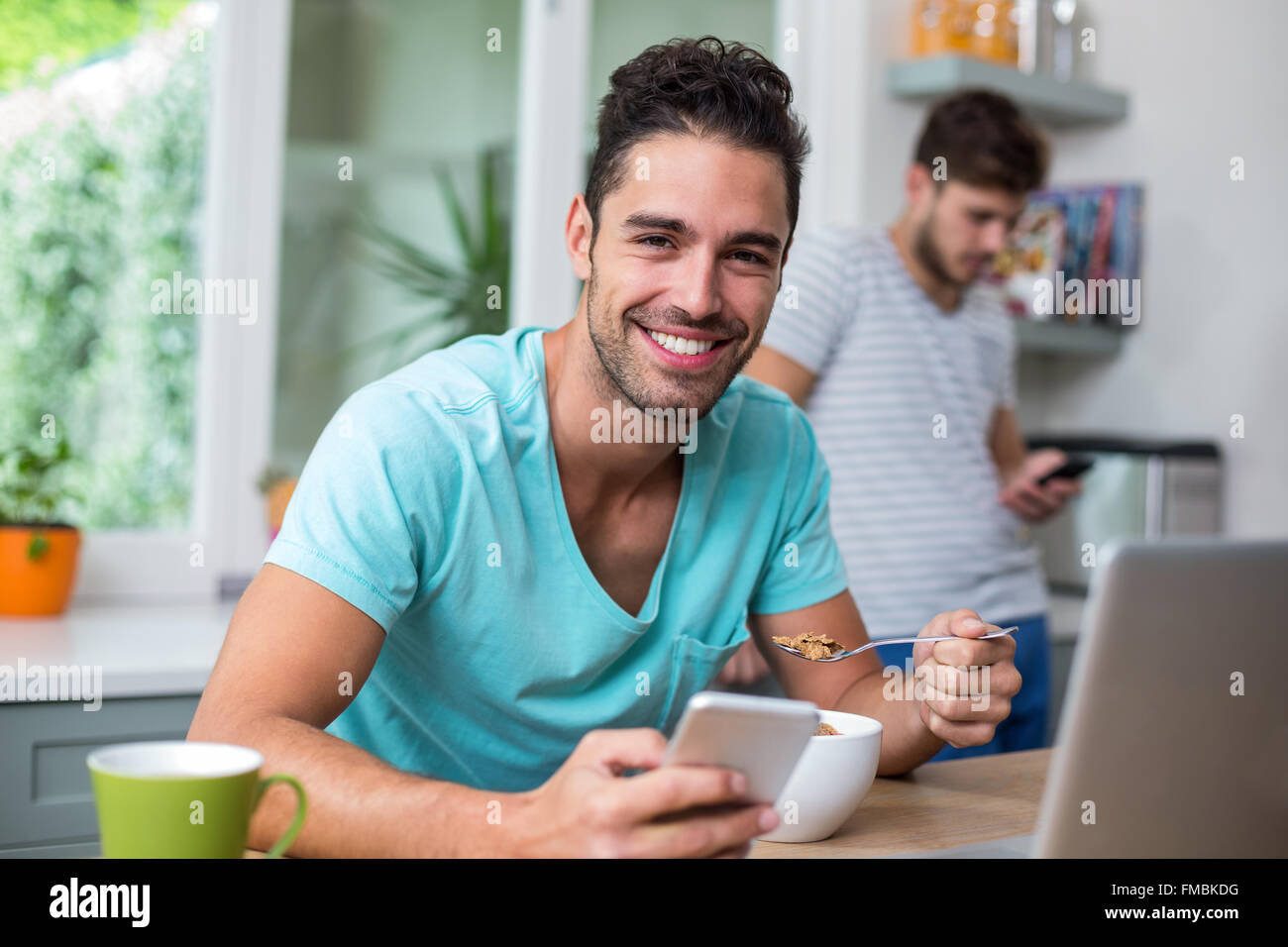 Portrait of smart cheerful man using phone Stock Photo - Alamy