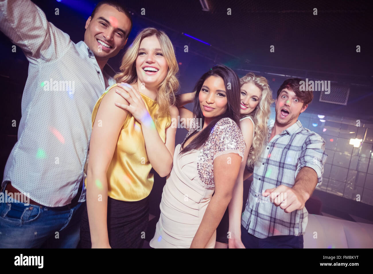 Happy friends dancing Stock Photo - Alamy