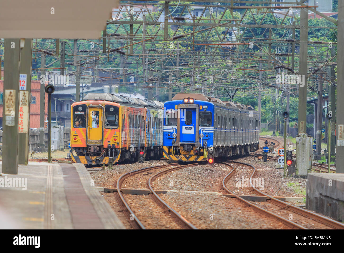 Blue and orange color trains of Taiwan Railway Stock Photo - Alamy