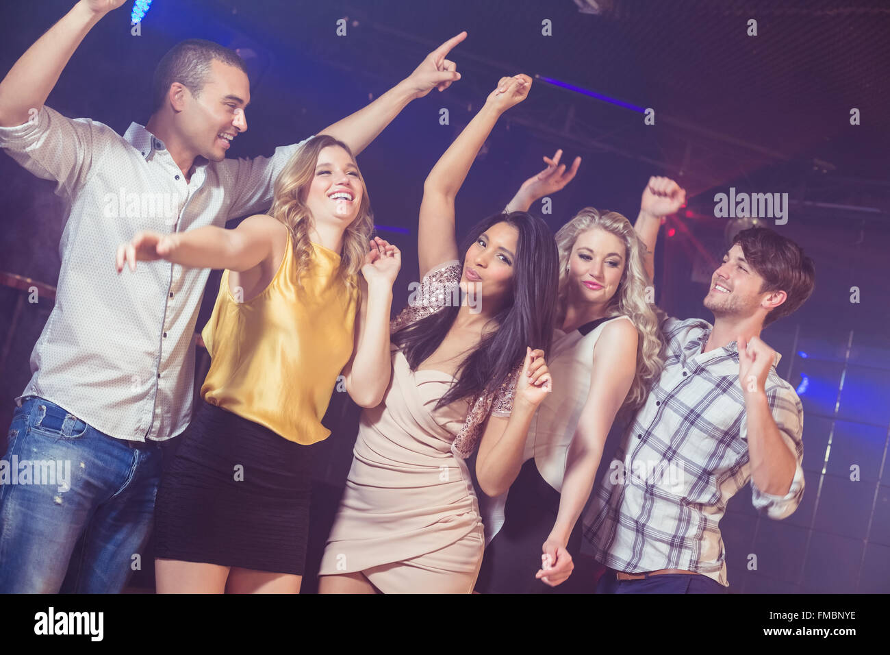 Happy friends dancing Stock Photo - Alamy
