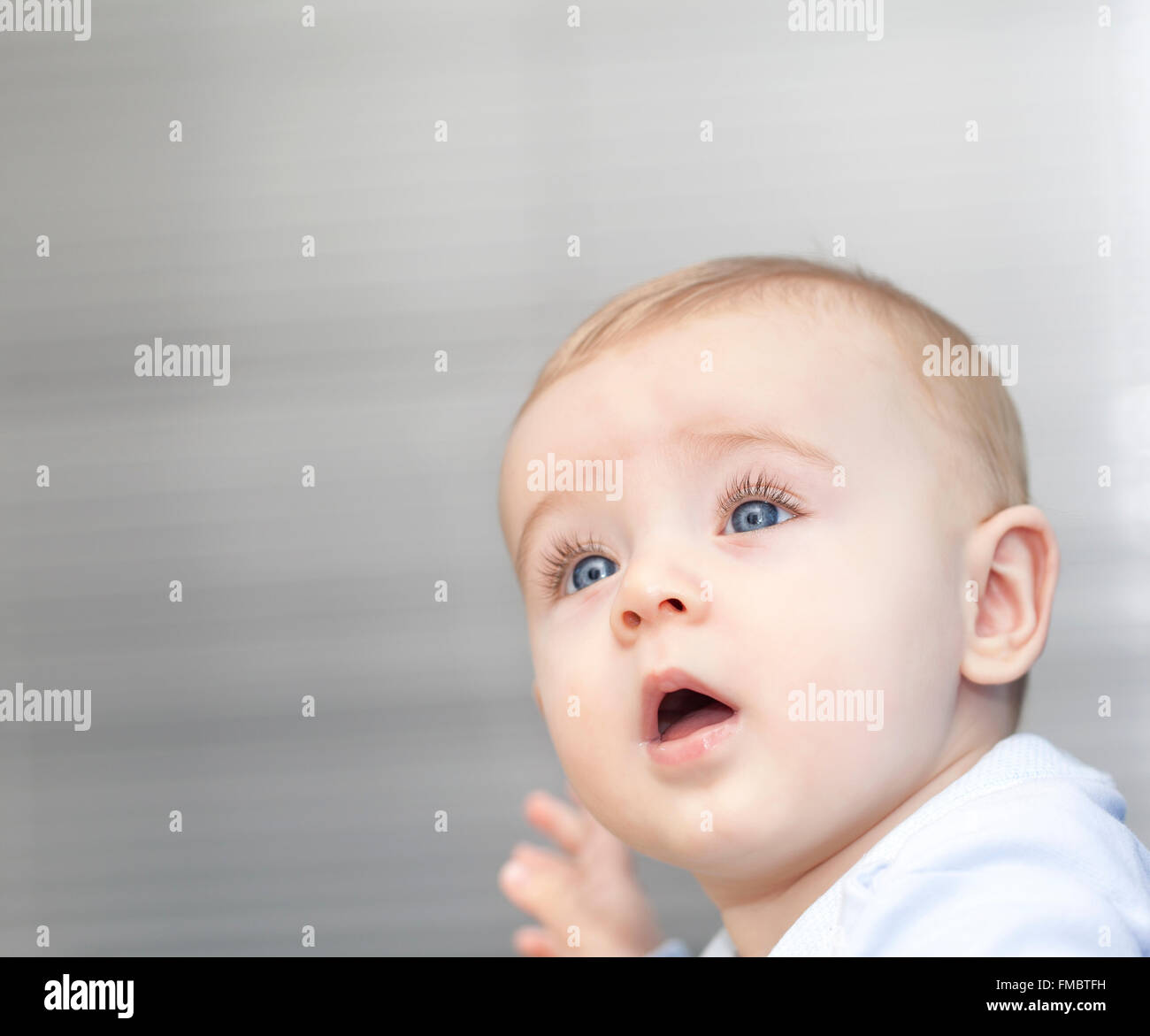 Adorable baby looking up Stock Photo - Alamy