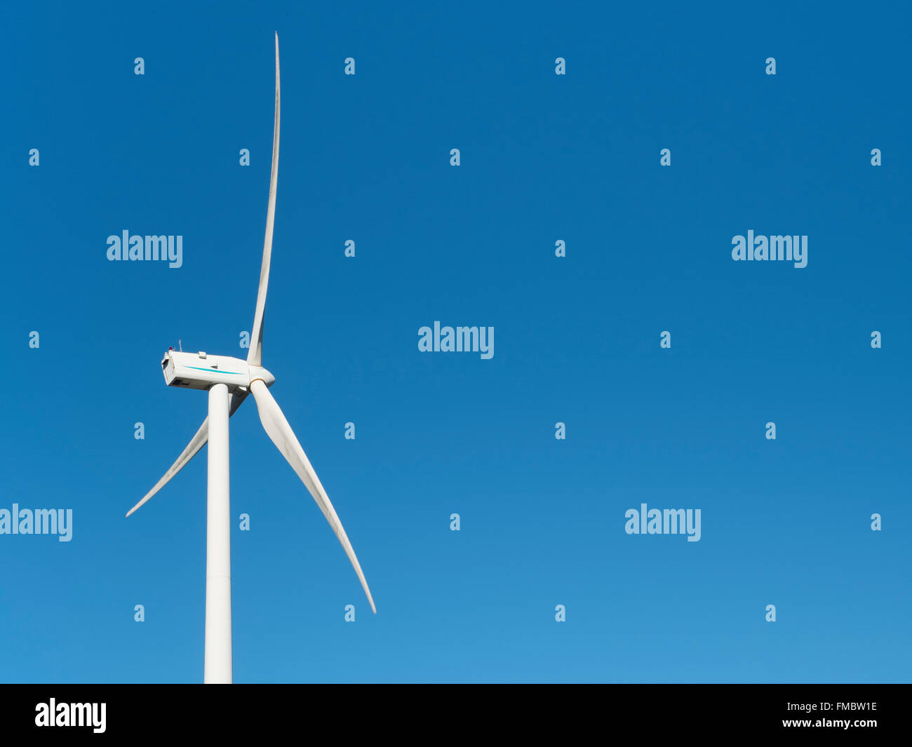 Single windmill against blue sky Stock Photo - Alamy