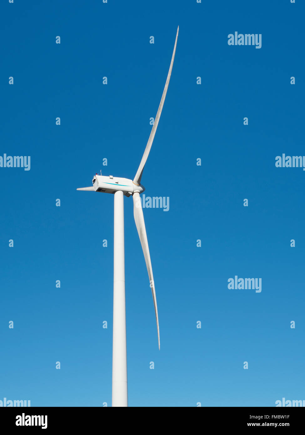 Single windmill against blue sky Stock Photo - Alamy