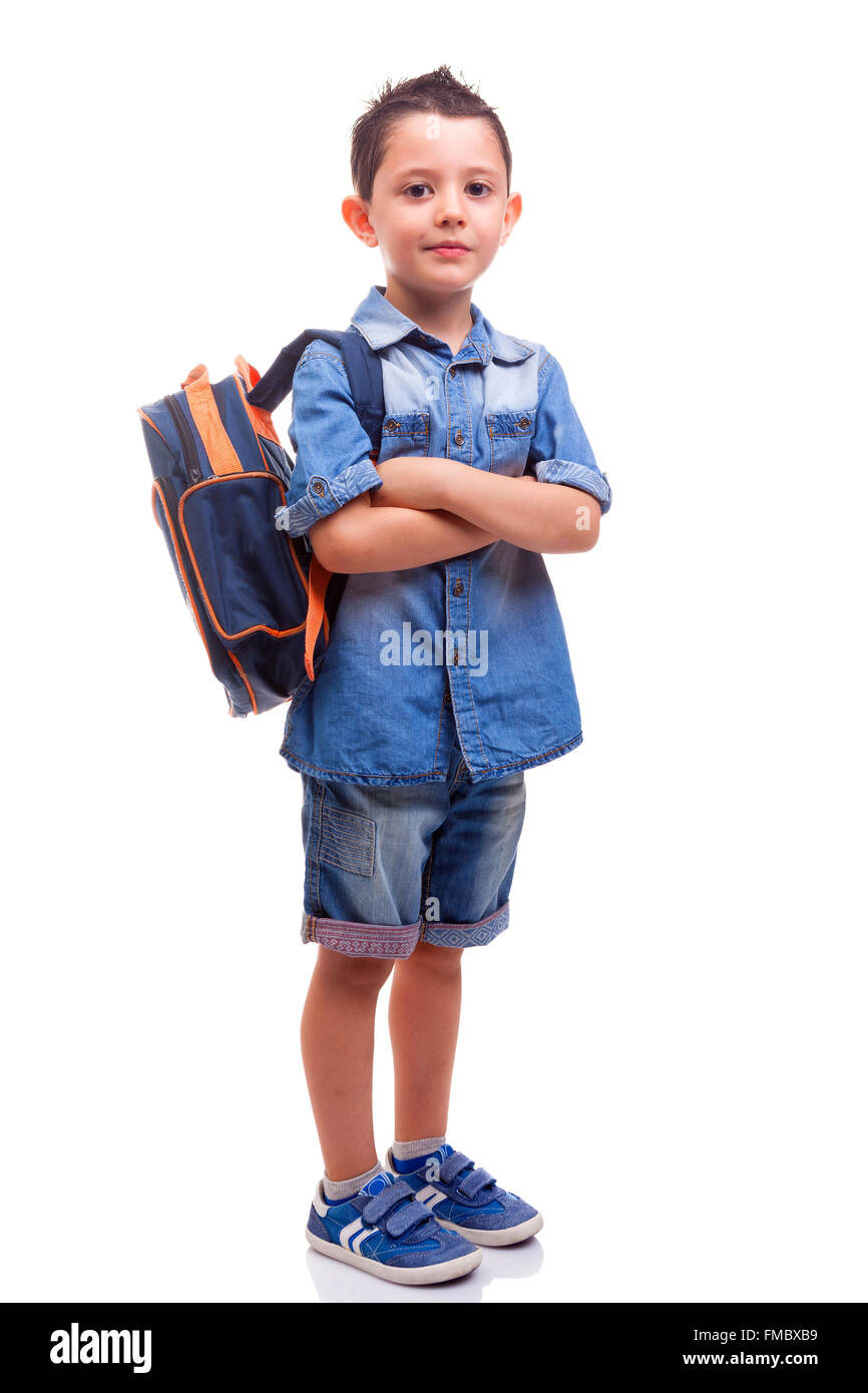School kid standing with arms crossed on white background Stock Photo ...