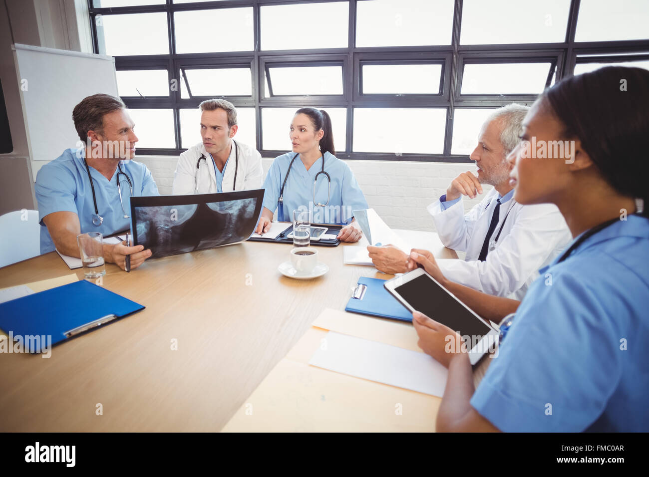 Medical team interacting in conference room Stock Photo - Alamy