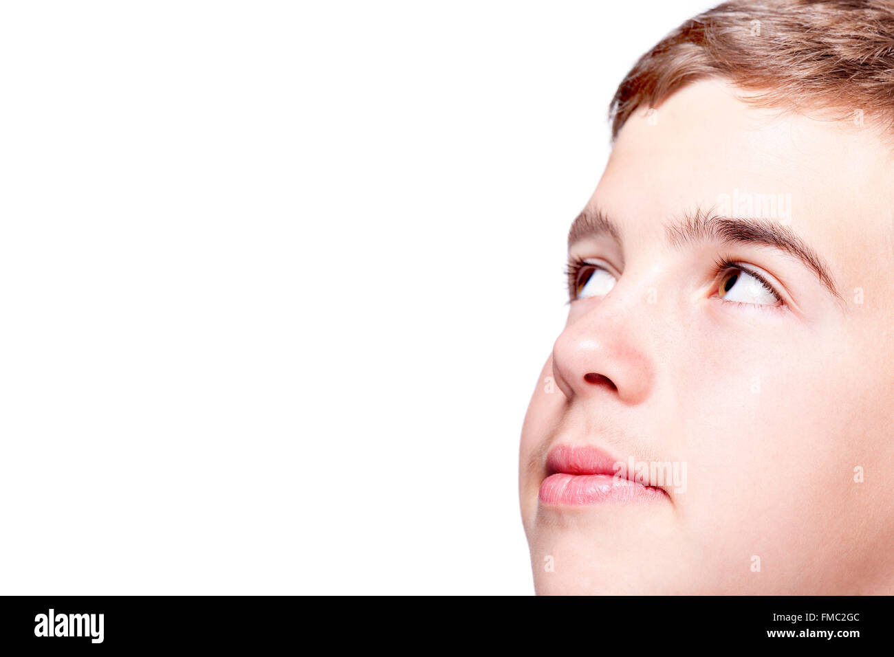 Headshot of a teen boy looking up, isolated on white background Stock ...