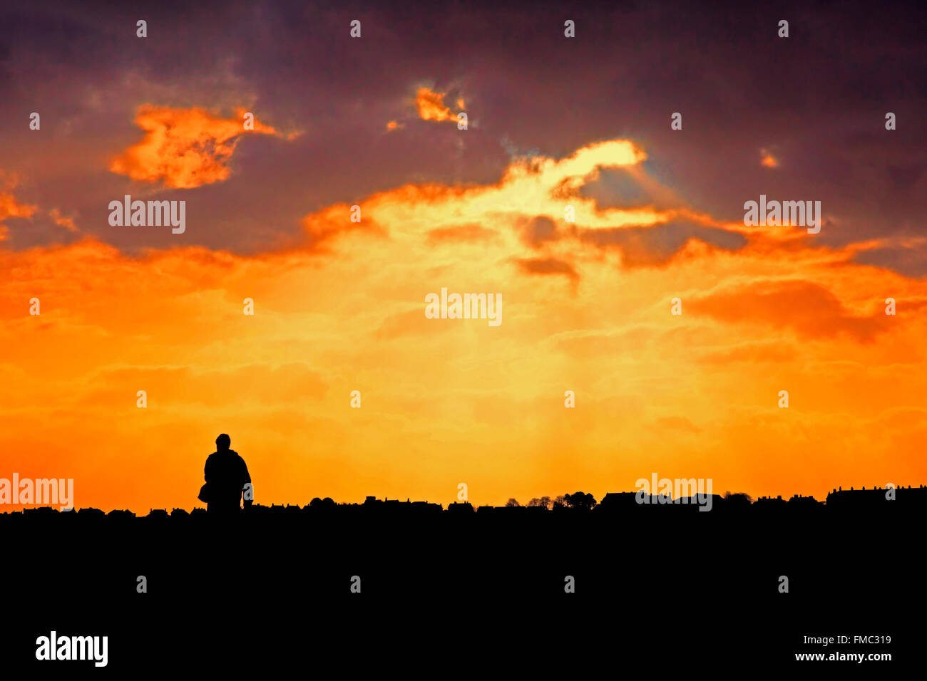 man walks home afrter a hard days work against a backdrop of urban ...