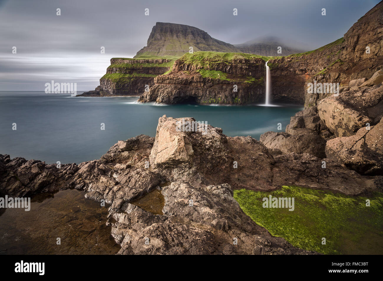 Gasadalur village and its waterfall, Faroe Islands, Denmark Stock Photo ...