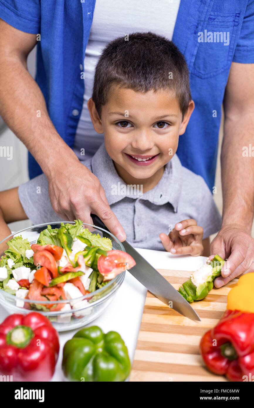 Boy chopping vegetables in the kitchen Stock Photo - Alamy
