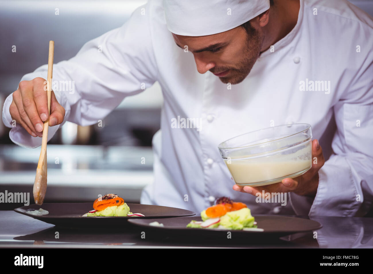 Professional chef adding sauce hi-res stock photography and images - Alamy