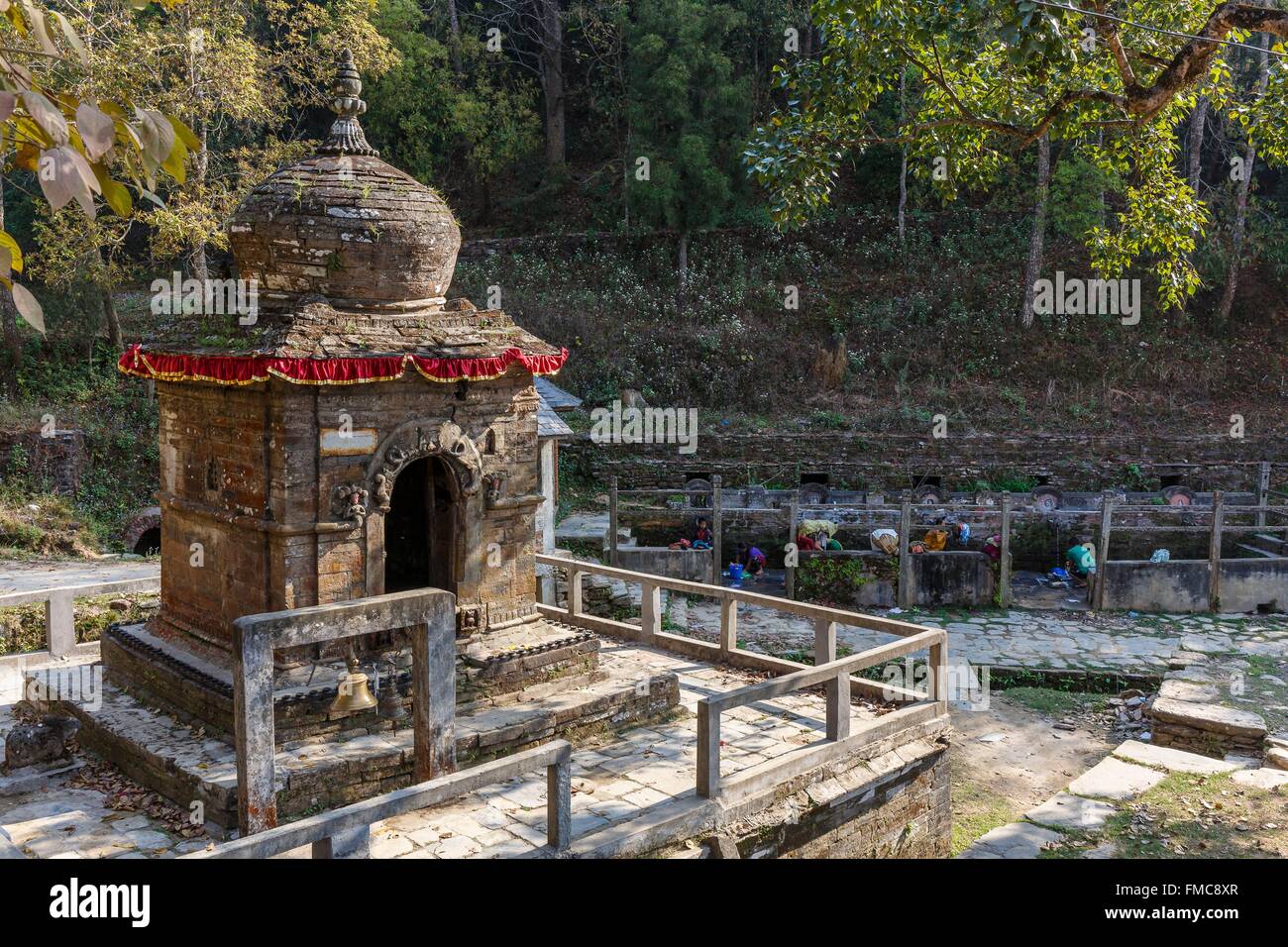 Nepal, Gandaki zone, Bandipur, a temple and women washing at the ...