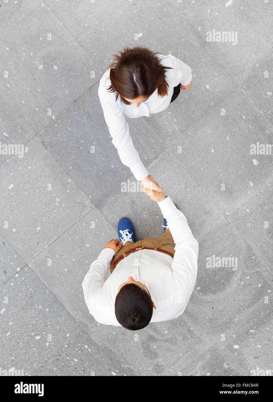 Top view of businesspeople shaking hands outdoors Stock Photo - Alamy