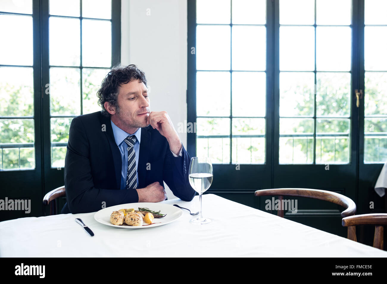 Smart man suit restaurant table hi-res stock photography and images - Alamy