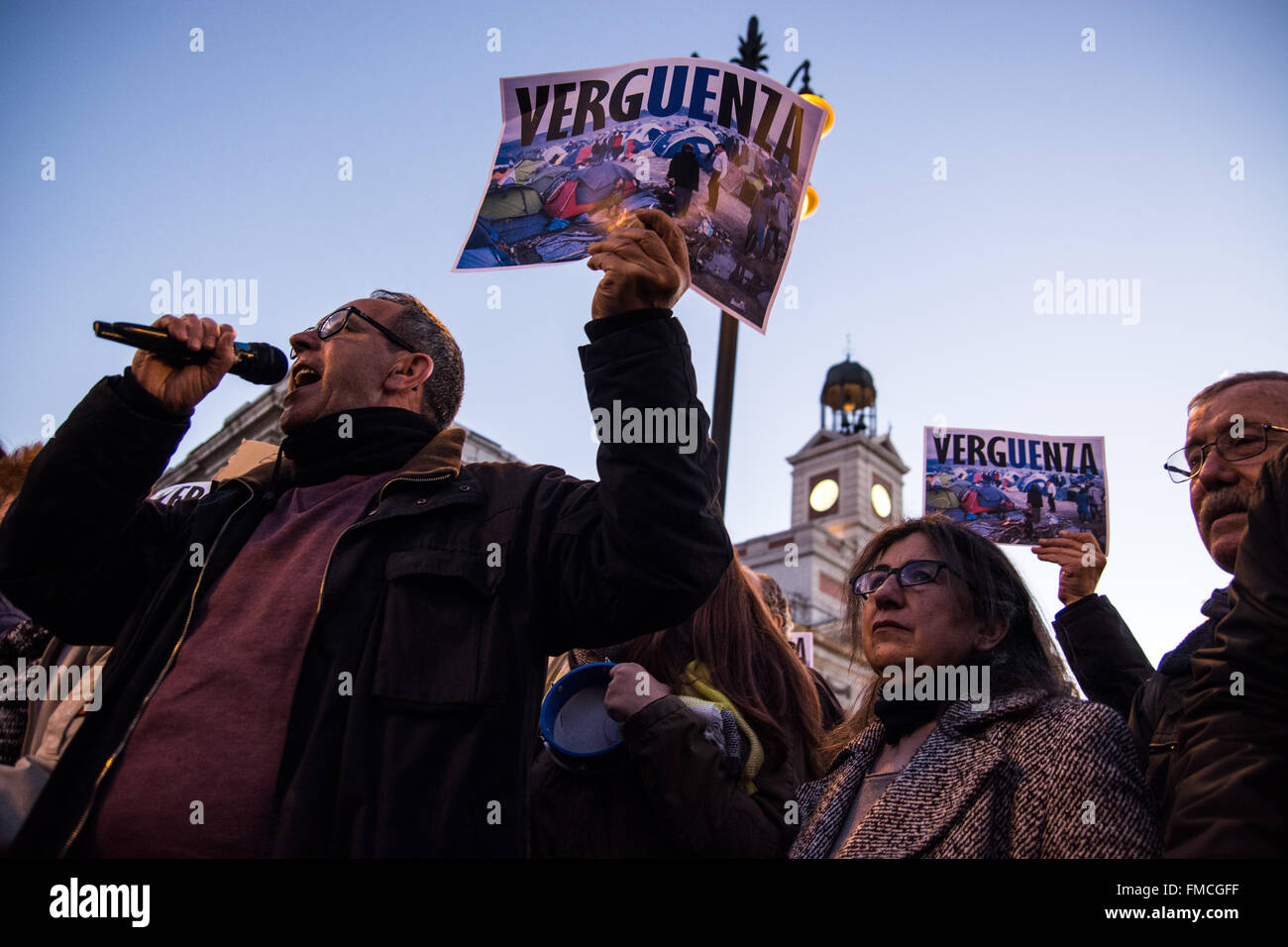 Madrid, Spain. 11th Mar, 2016. People with pictures of refugees camps ...